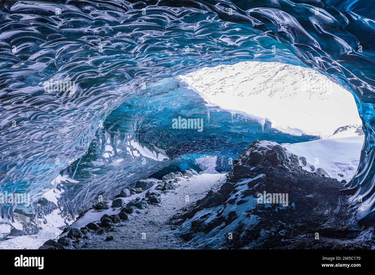Aquamarine-coloured ice combs at the entrance to Proeng Ice Cave ...