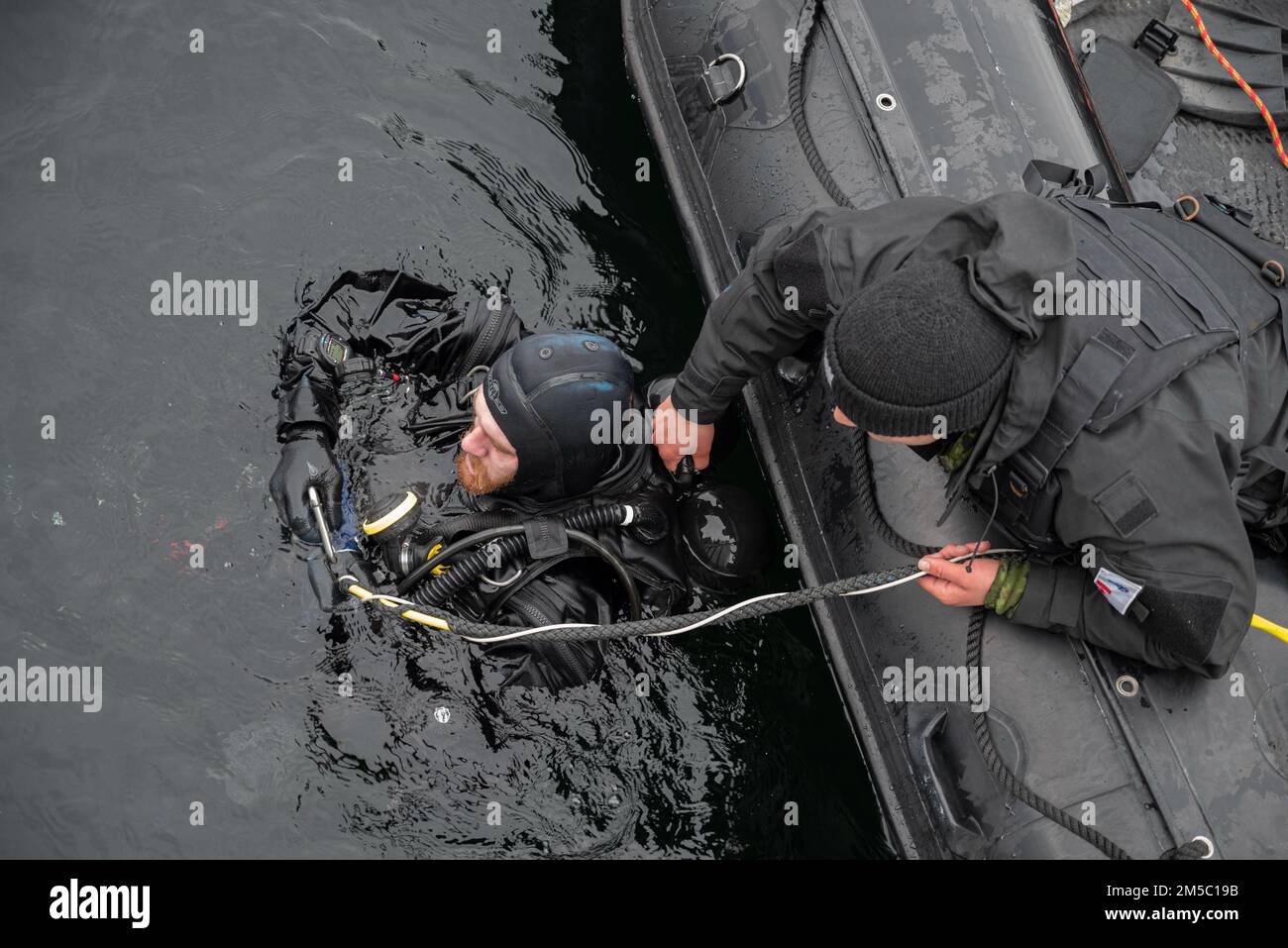 Sailor First Class Jarrett Theberge pulls Sailor First Class Aaron ...