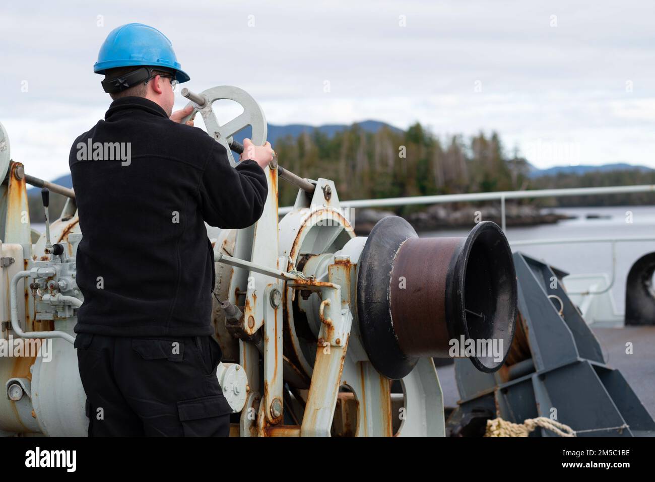 Sailor First Class Alex Moore operates the anchor breaking mechanism on ...