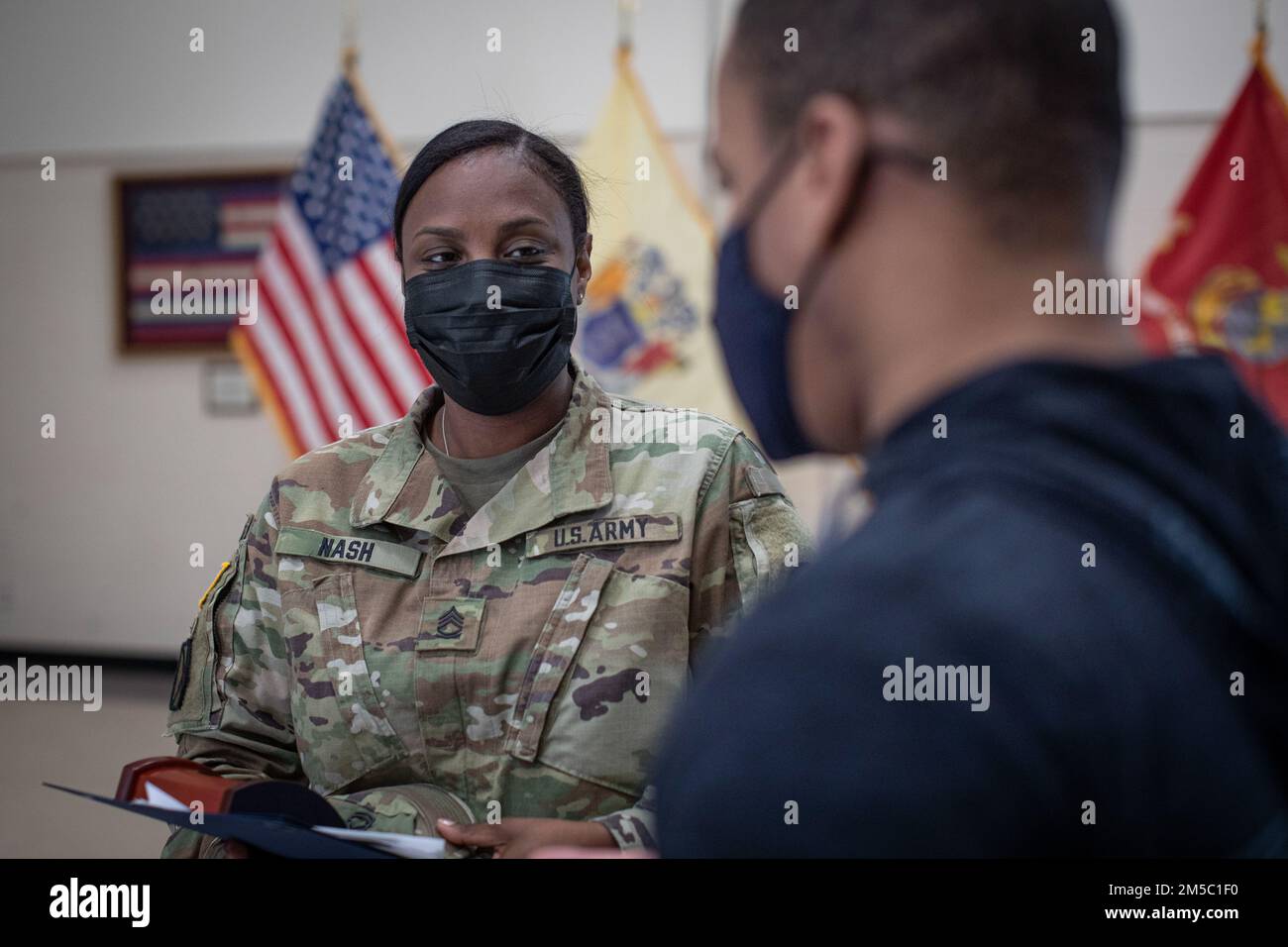 U.S. Army Sgt. 1st Class Quintessa Nash speaks with guests at a Black ...