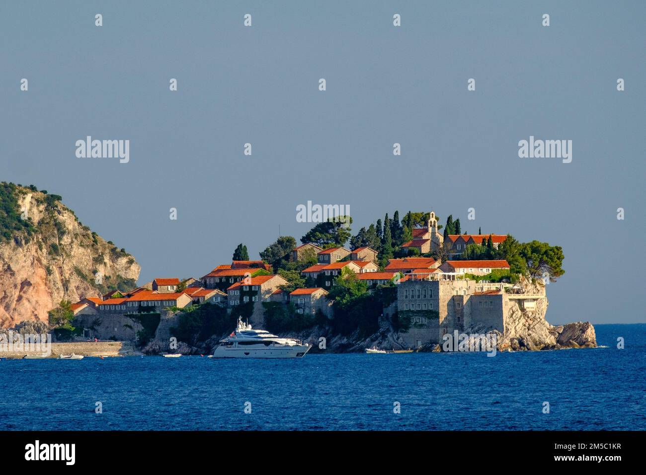 The St Stephen island with a blue sky in the background, Montenegro ...