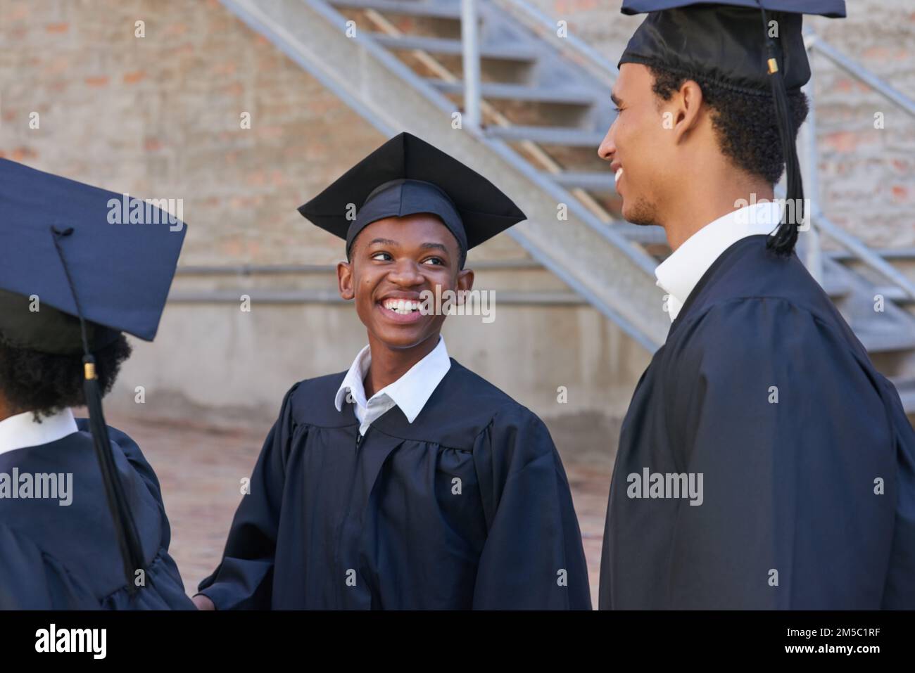 Waiting for their names to be called. a happy group of students ...