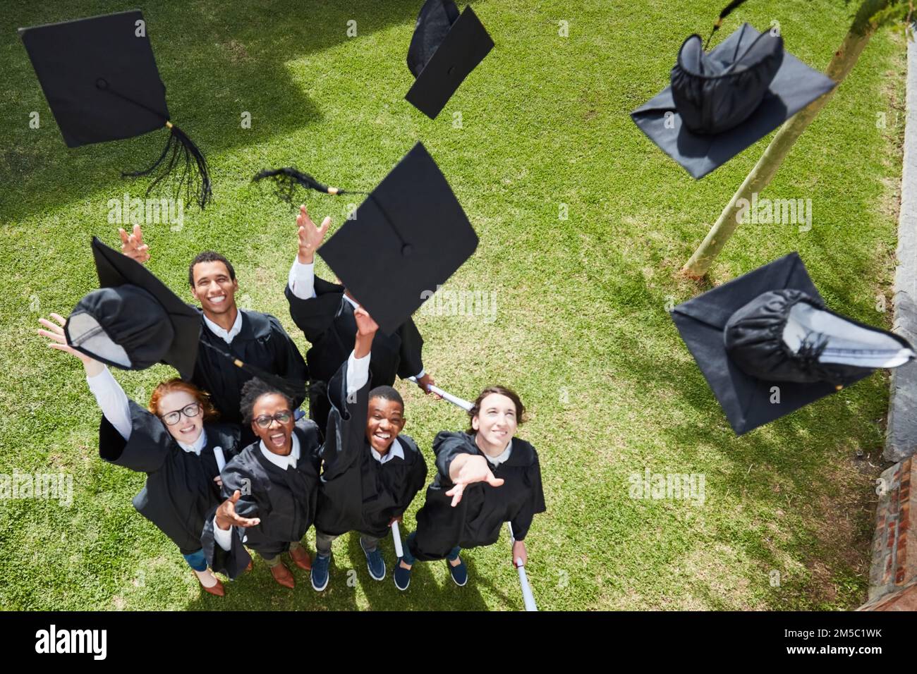 College students graduation caps air hi-res stock photography and ...