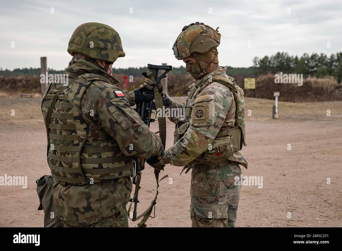 A Polish soldier assigned to the 21st Rifle Brigade instructs a ...