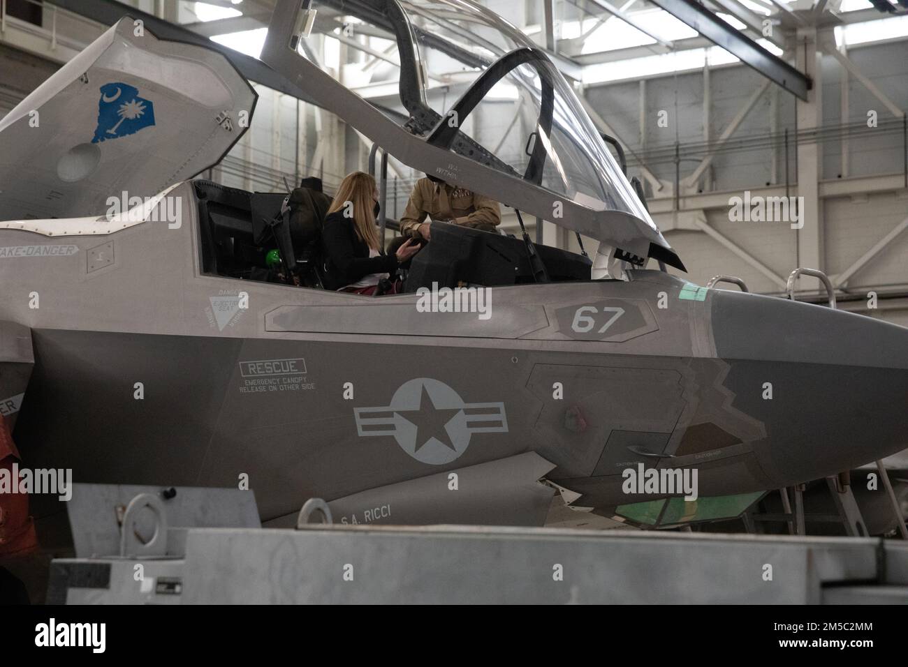 The honorable Meredith A. Berger, under secretary of the Navy, sits in ...