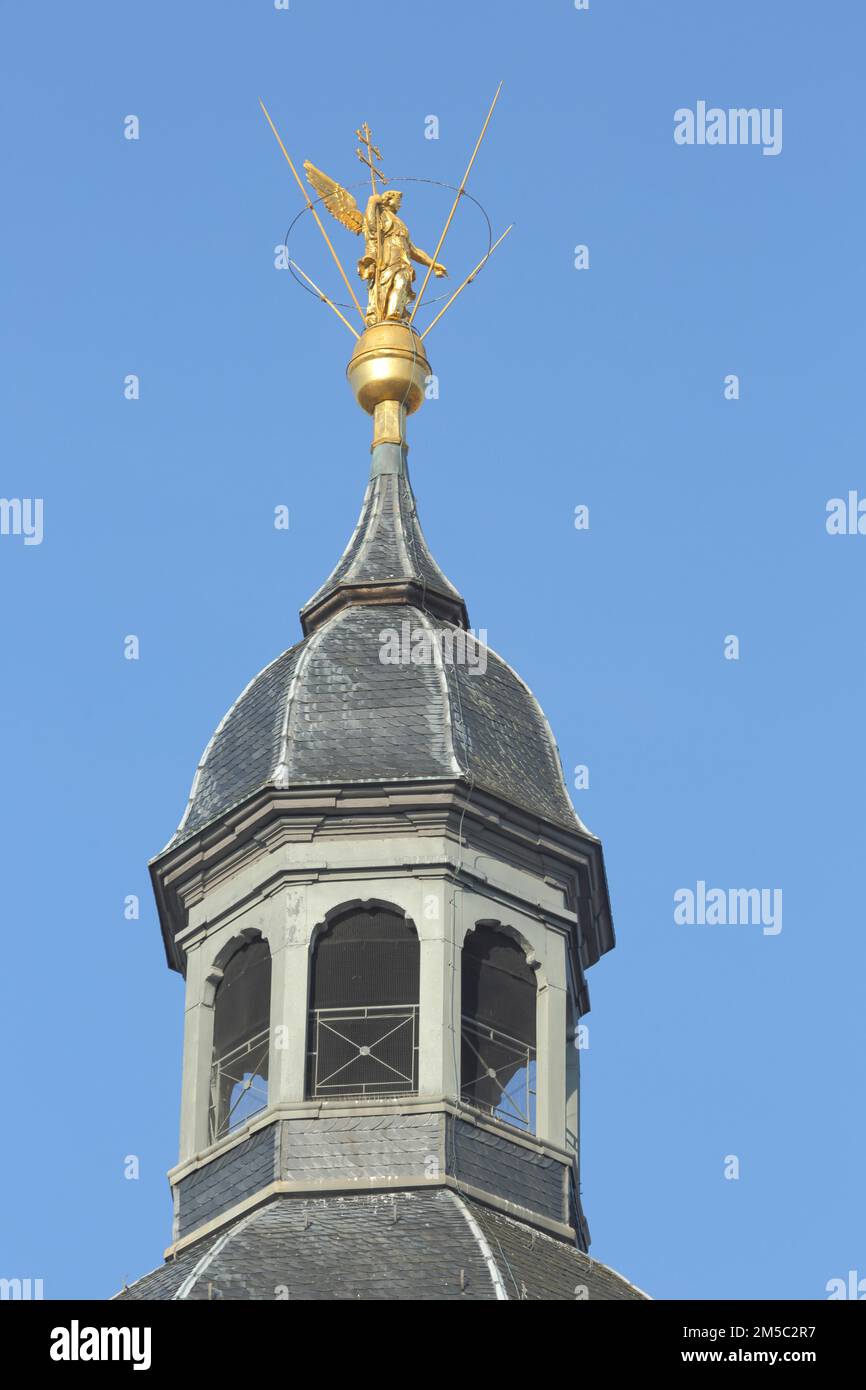Spire with golden figure on the Einhard Basilica of St. Marcellinus and ...