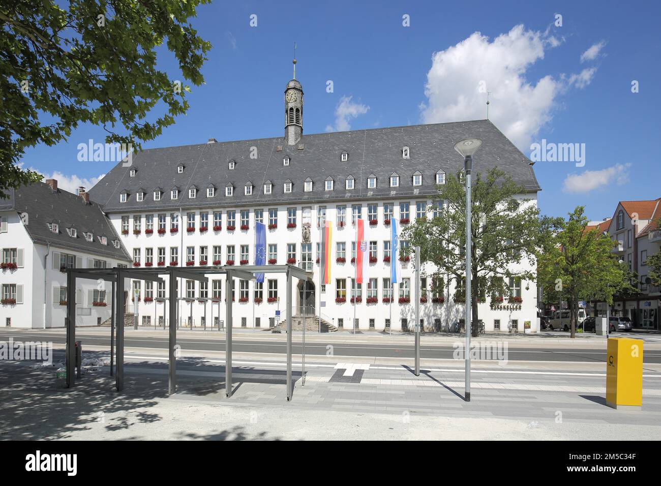 Town hall with EU flag, state flag, national flag and city flag ...