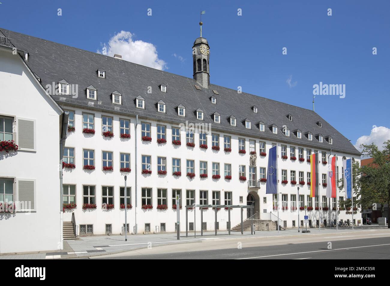 Town hall with EU flag, state flag, national flag and city flag ...