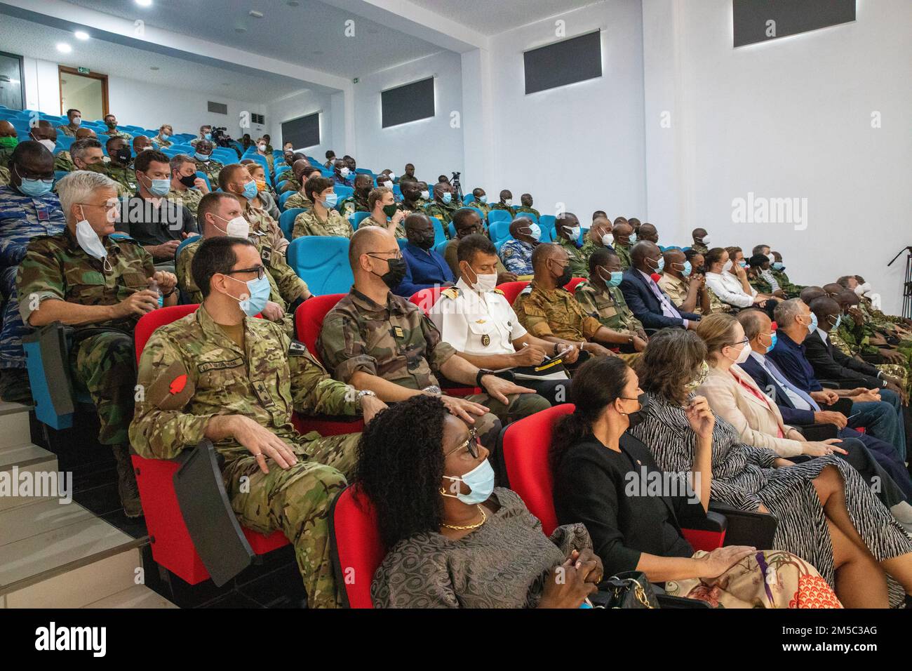 Distinguished visitors from partner nations attend an overview brief ...