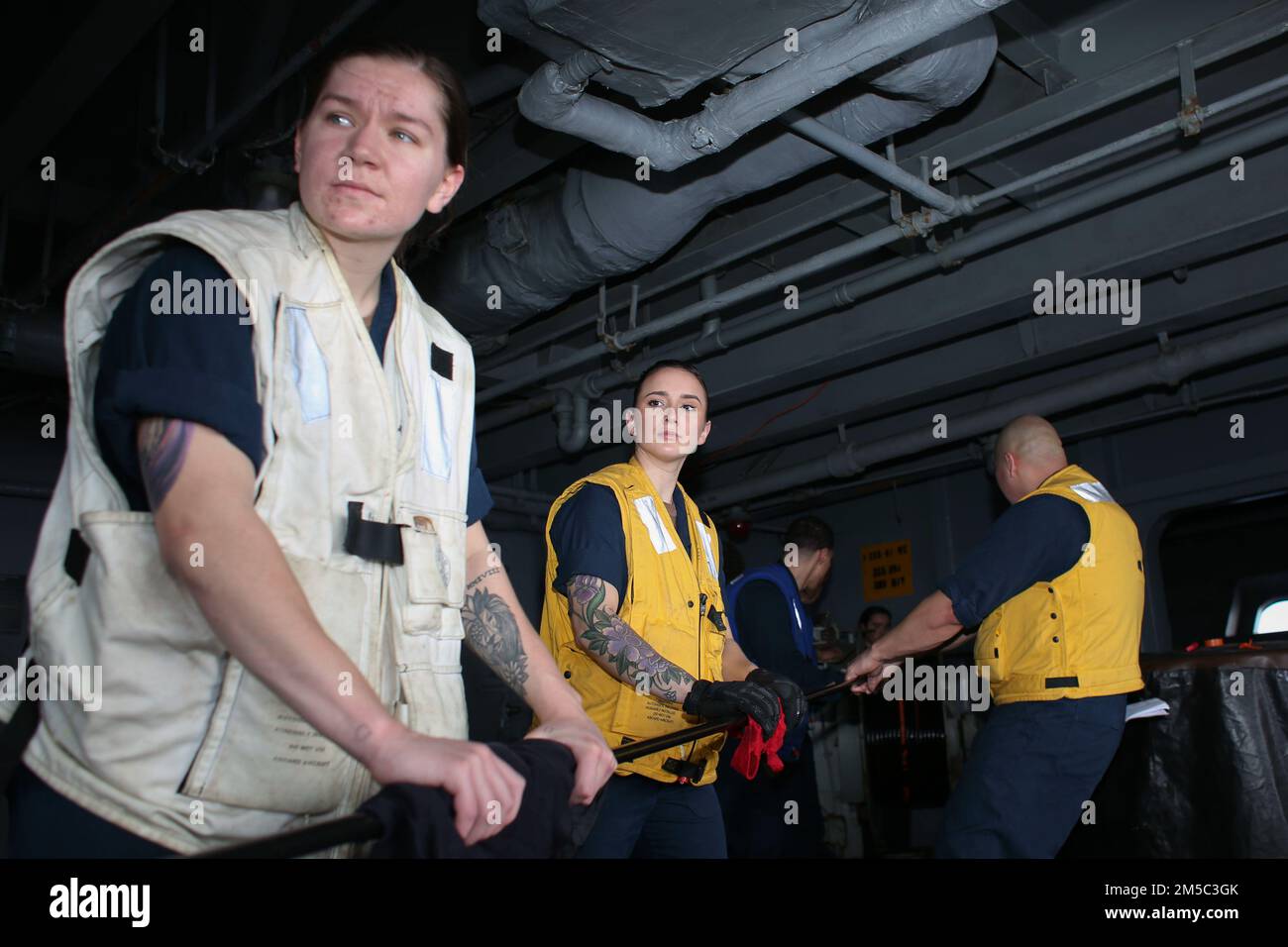 PHILIPPINE SEA (Feb. 27, 2022) Sailors bring in the ship’s torpedo ...