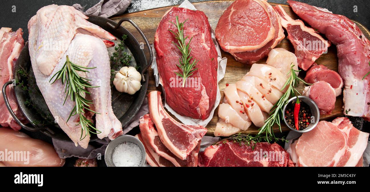 Different types of raw meat - beef, pork, lamb, chicken on dark ...