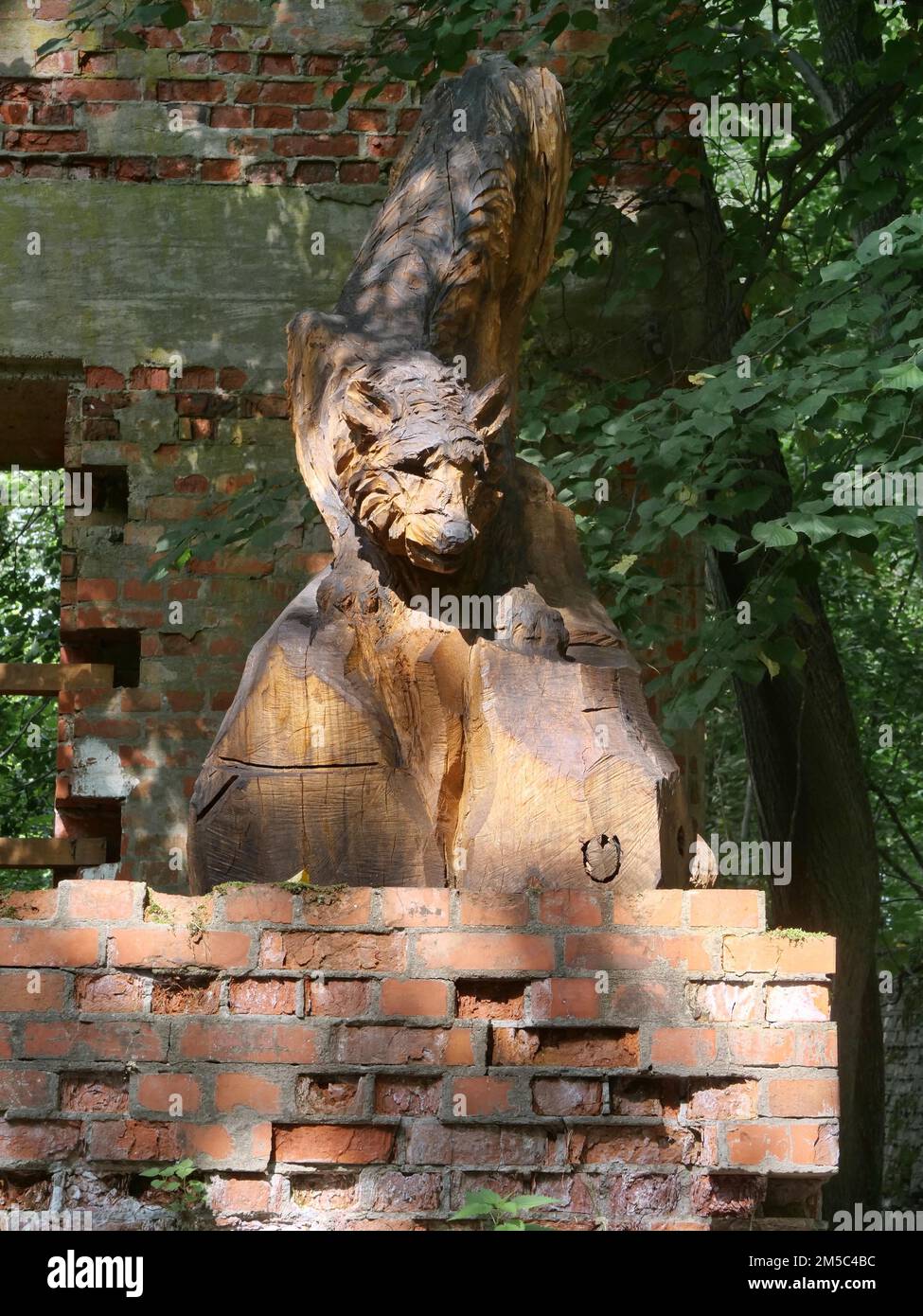 Wolf carved in wood in the ruins of the Wolf's Lair (also Wolfschanze ...