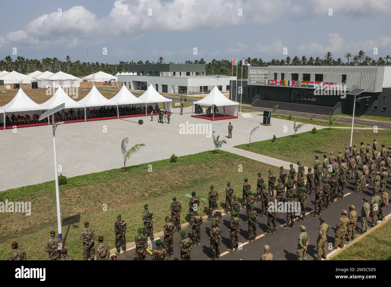 11 partner nations stand alongside each other in formation during the ...