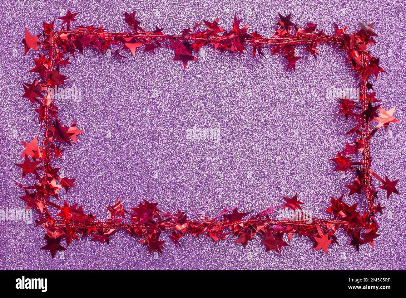 Winter holidays backdrop with red stars rectangular frame, on purple ...