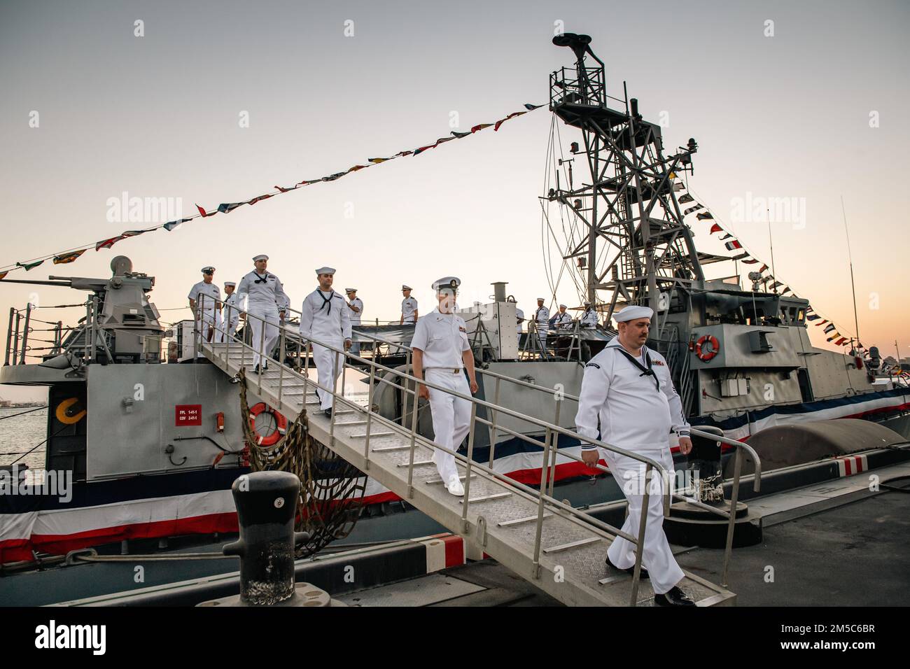 220228-N-KZ419-1849 MANAMA, Bahrain (Feb. 28, 2022) Sailors disembark ...