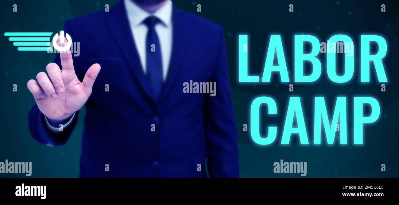 Hand writing sign Labor Camp. Word for a penal colony where forced ...