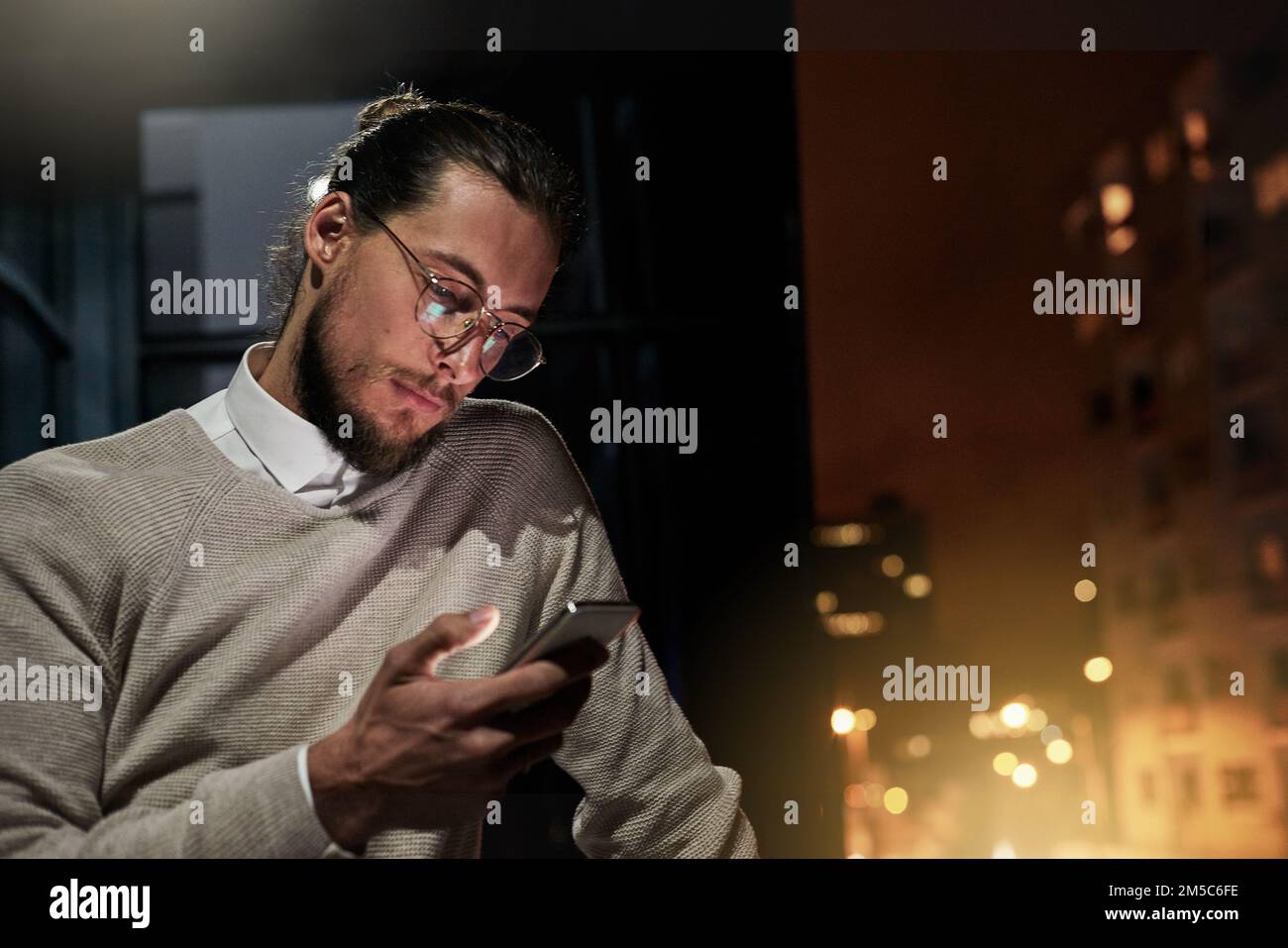 Sending out a late night project update. a handsome young designer ...