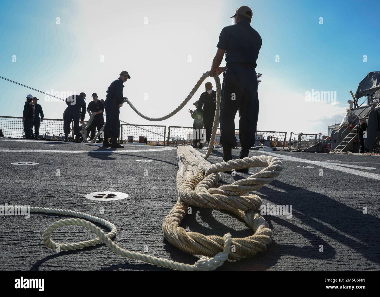 ROTA, Spain (Feb. 28, 2022) – Sailors fake-out a mooring line after ...
