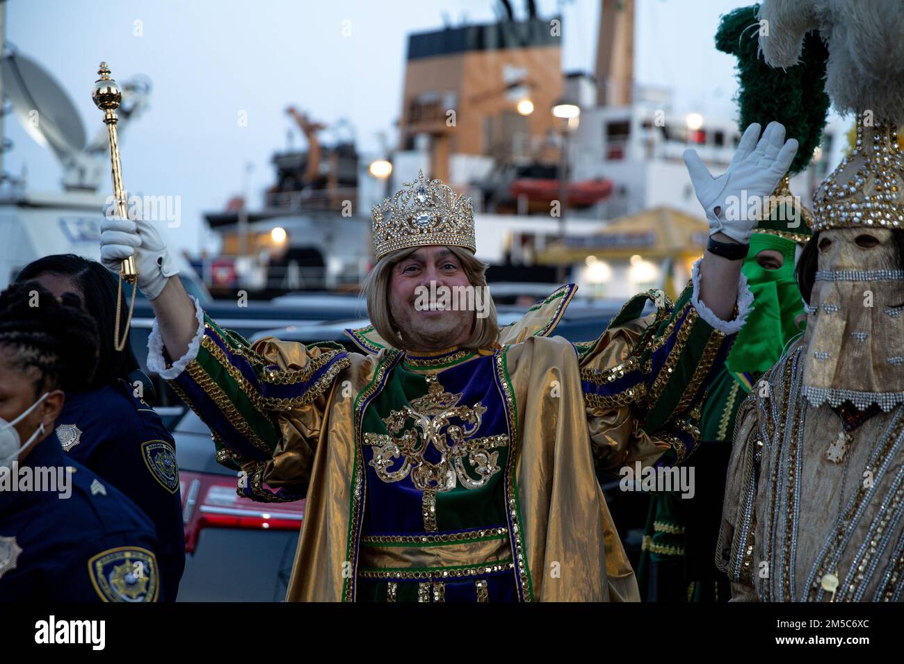 James Reiss III, crowned Rex, waves to a crowd of onlookers after ...