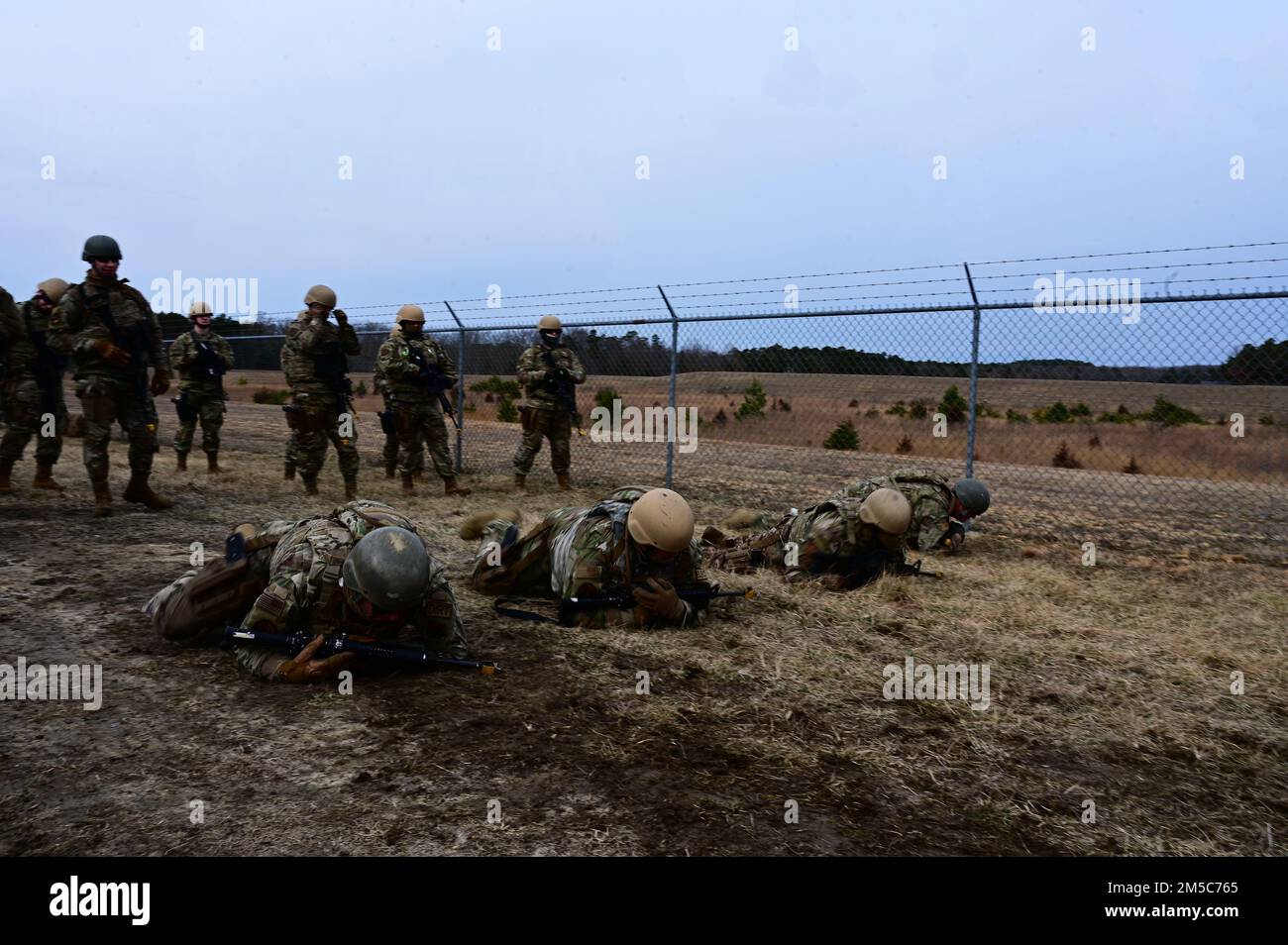U.S. Air Force Field Craft Hostile students low-crawl while ...