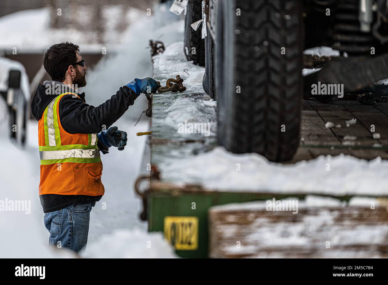 Andrew Maiorano, a truck driver with Alaska West Express, unloads a ...