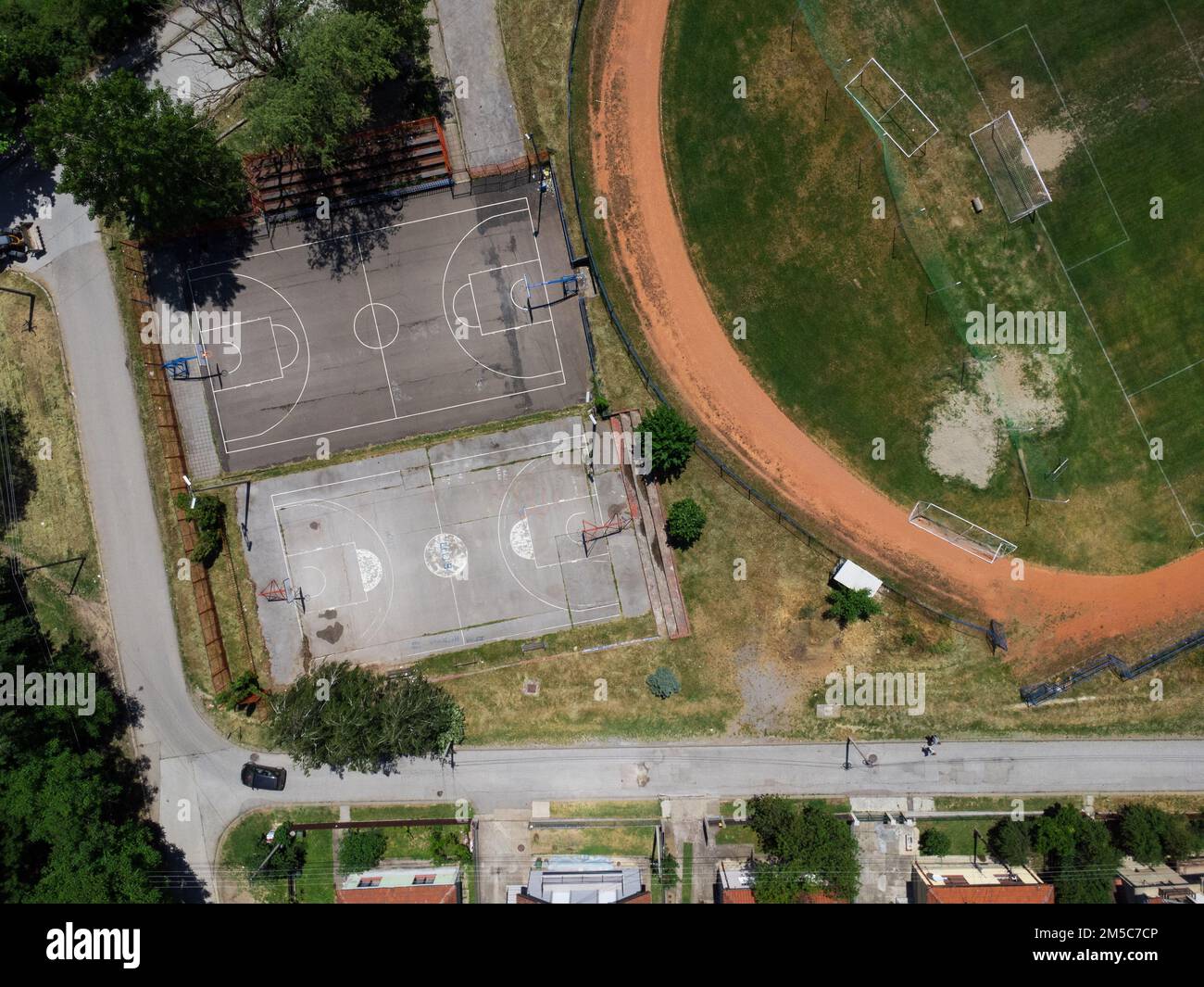 An aerial view of a football field and a basketball court in Valjevo ...