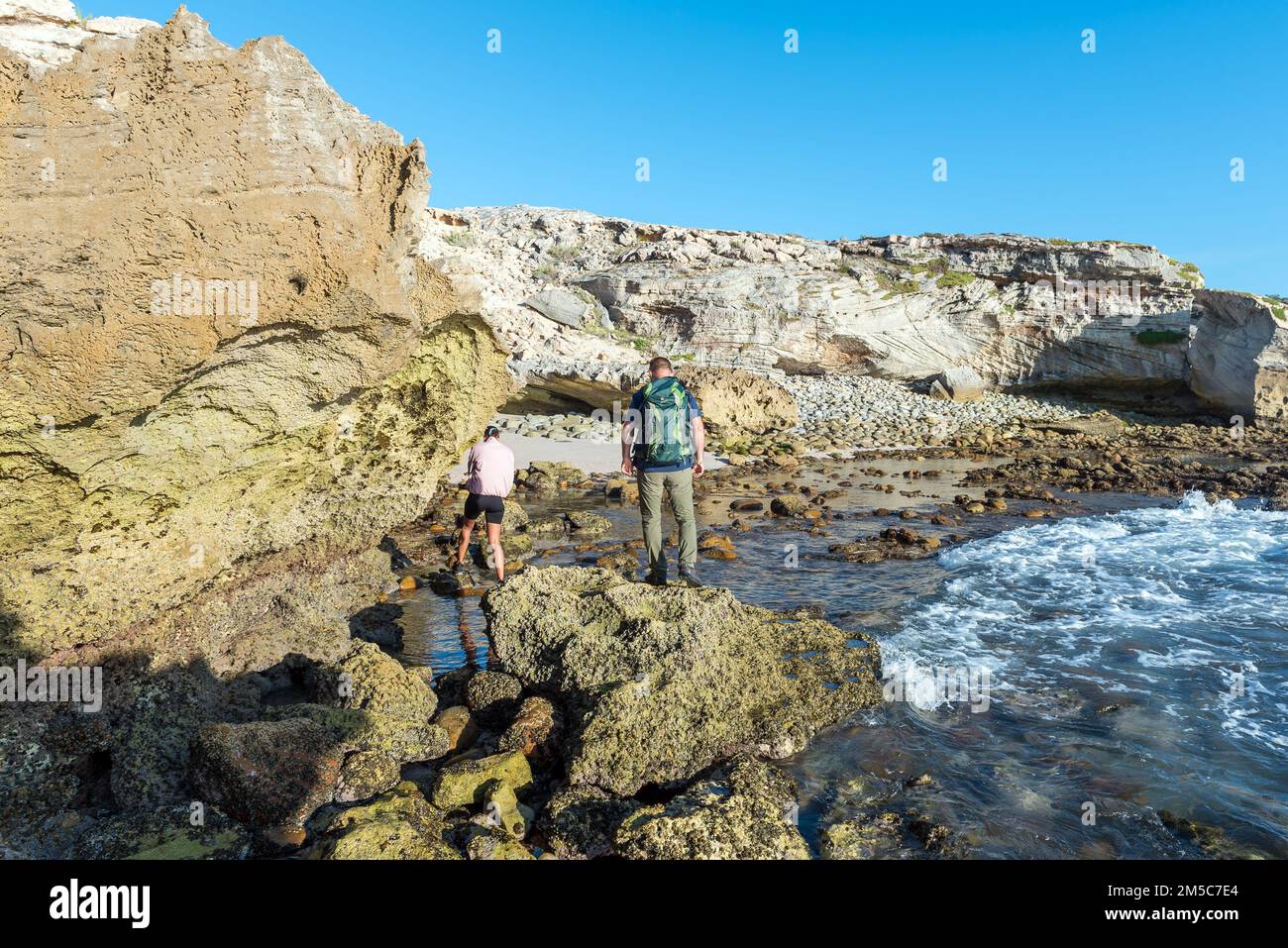 Arniston, South Africa - Sep 22, 2022: People walking back to the ...