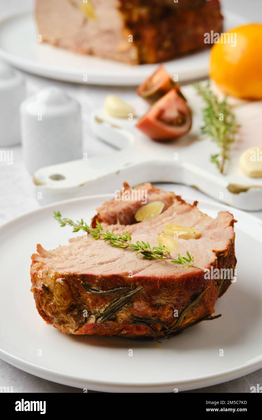Closeup view of slice of pork neck baked in oven on a plate Stock Photo ...