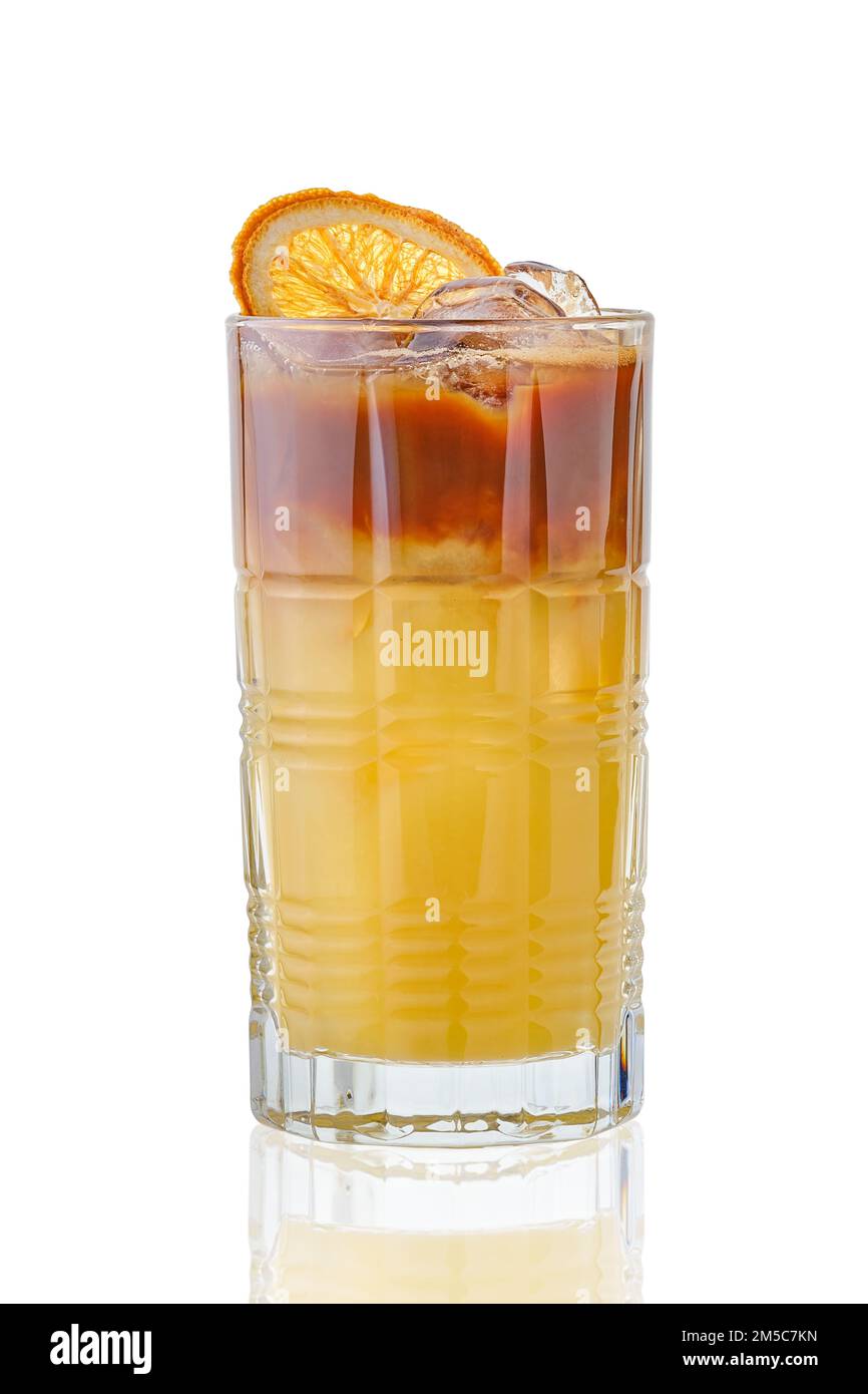 Citrus espresso and tonic cold drink in tall facetted glass with ...