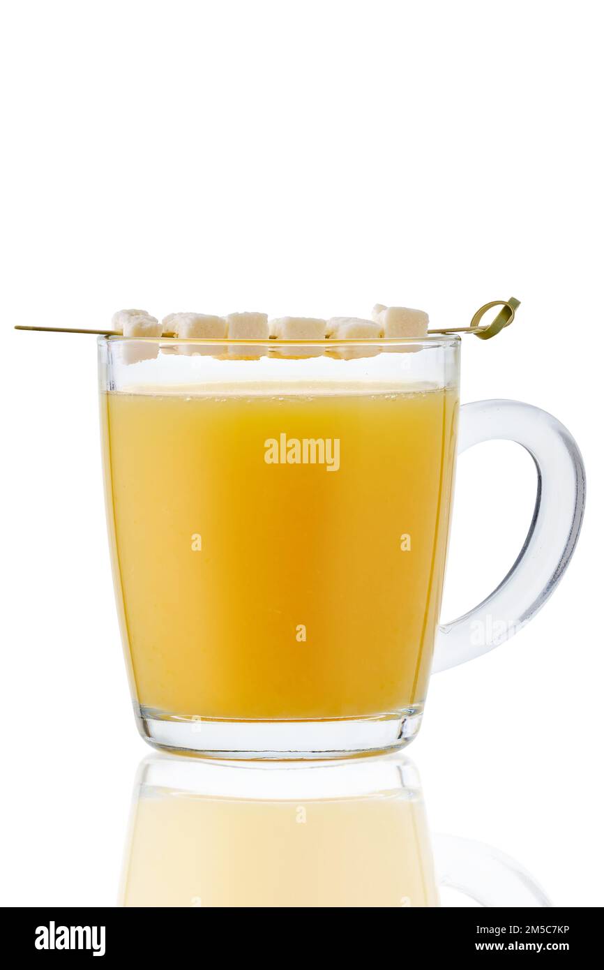 Hot non alcohol drink with orange juice and coconut milk served with ...