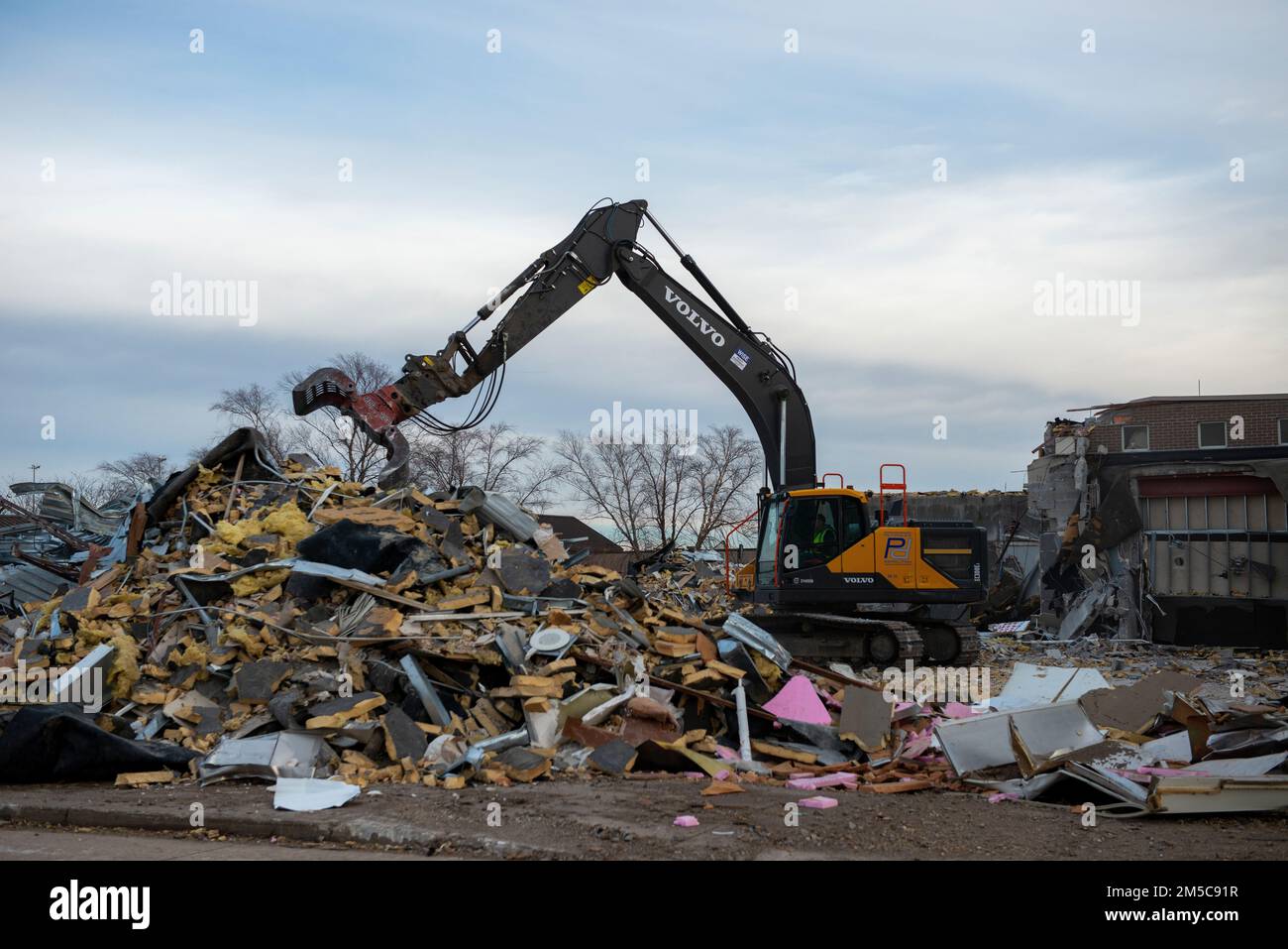 Contractors remove rubble of a building being demolished at Offutt Air ...