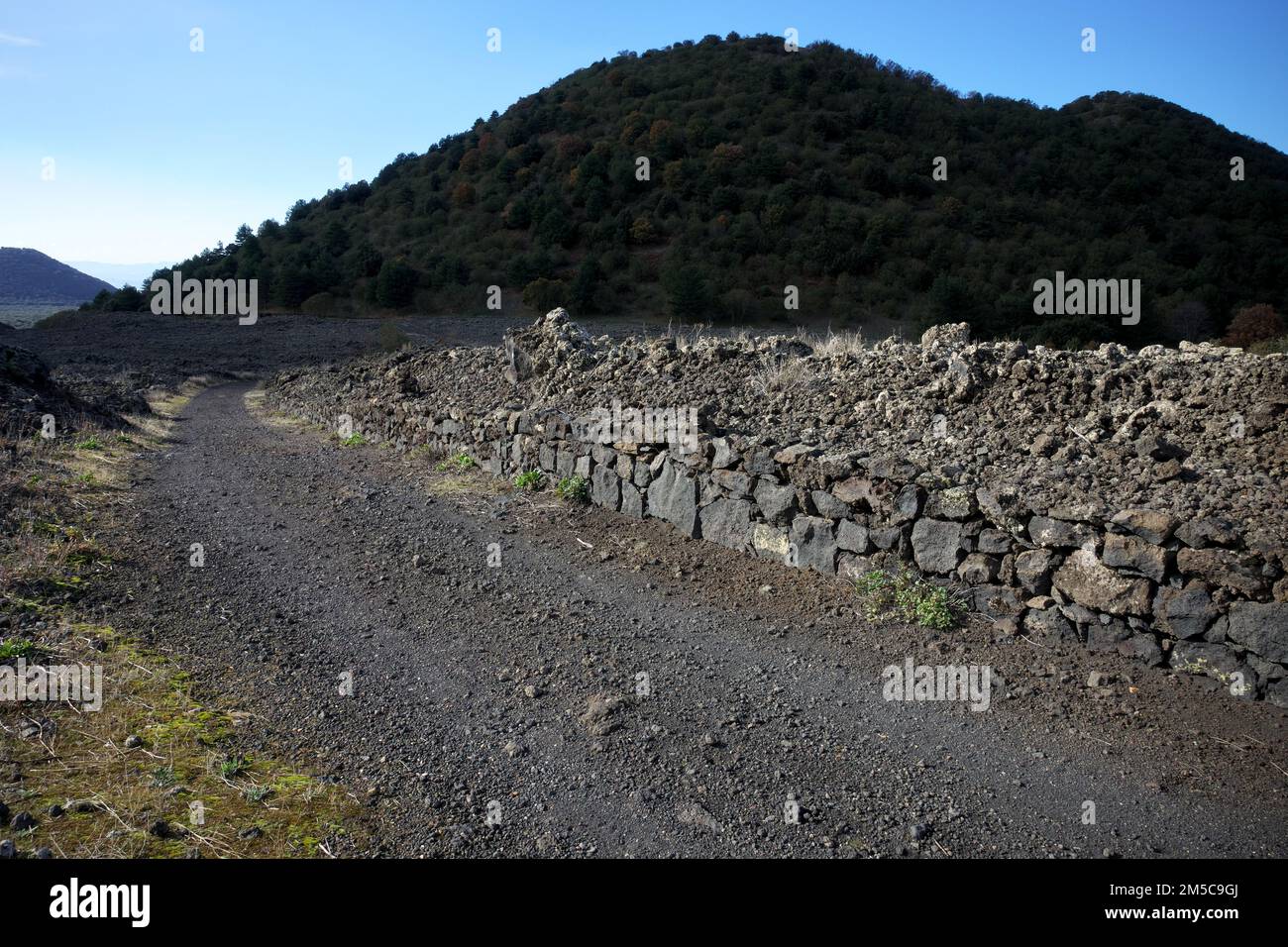 volcanic landscape with dirt road in Sicily, Etna Park, Italy Stock ...