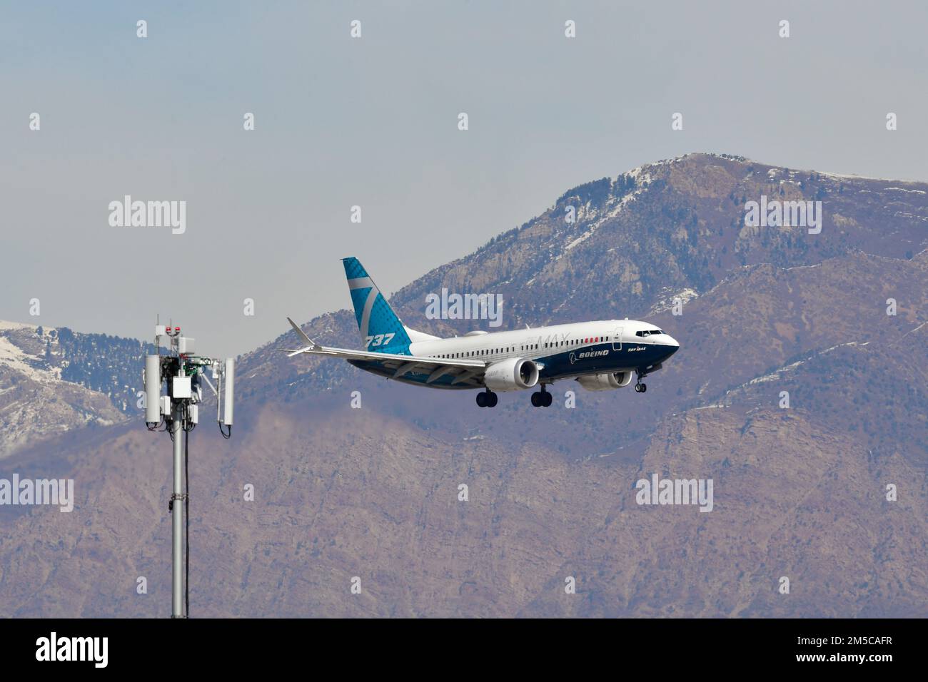 A 5G mobile test station is positioned on the edge of the runway while ...
