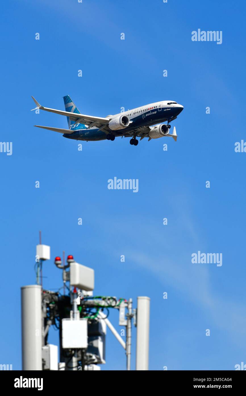 A 5G mobile test station is positioned on the edge of the runway while ...