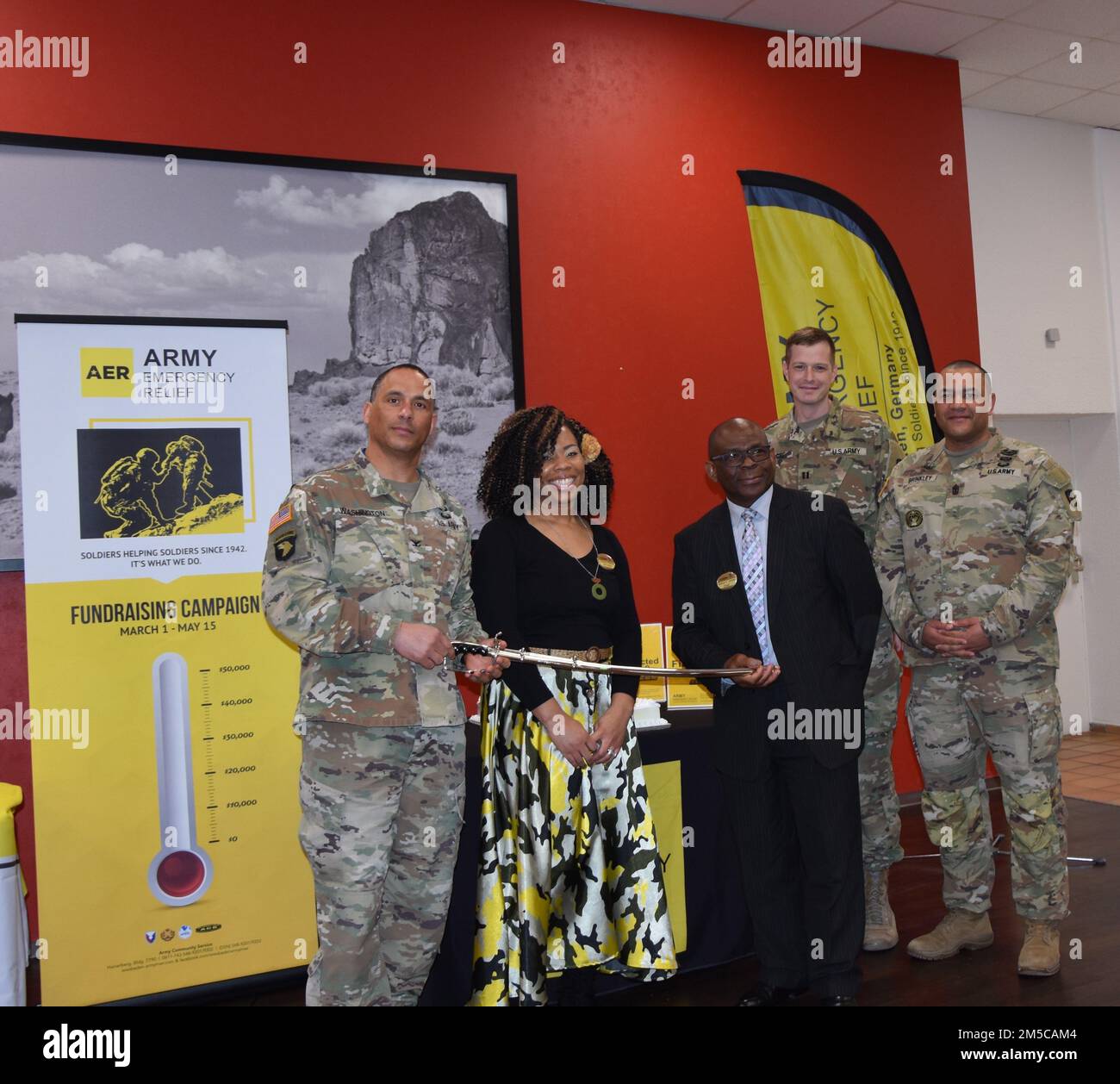 Col. Mario Washington, U.S. Army Garrison Wiesbaden Commander, Arthur Jones, director of the ...