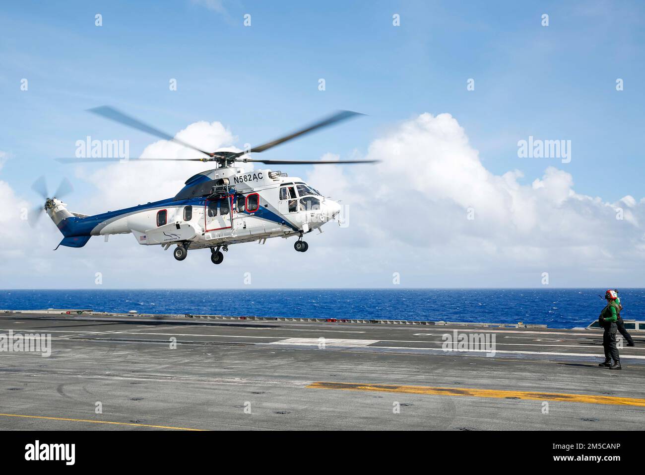 PHILIPPINE SEA (March 1, 2022) An AS332 Super Puma lifts off the flight ...