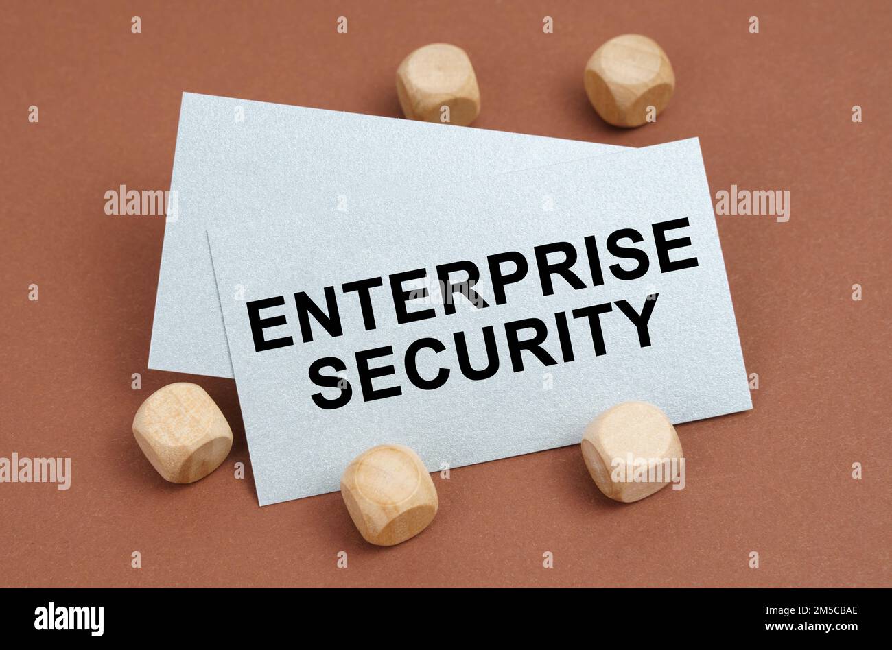 The concept of industrial safety. On a brown surface, wooden cubes and ...