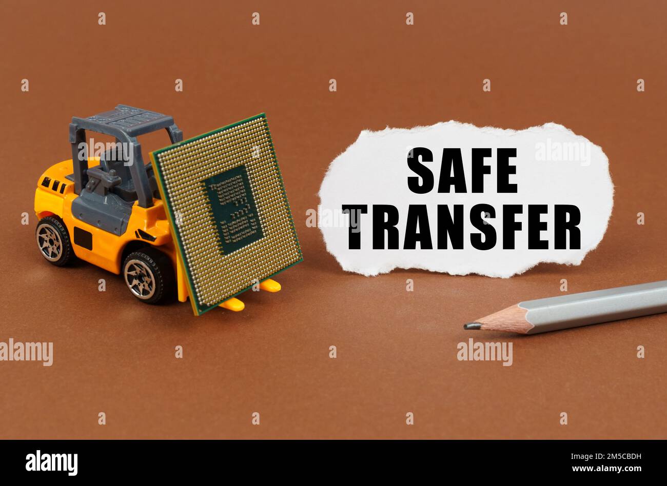Technological concept. On a brown surface, a forklift is transporting a ...