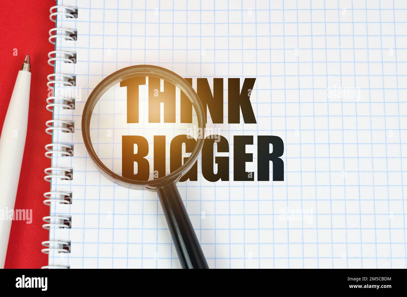 Business and finance concept. On the red surface is a pen, a notepad ...