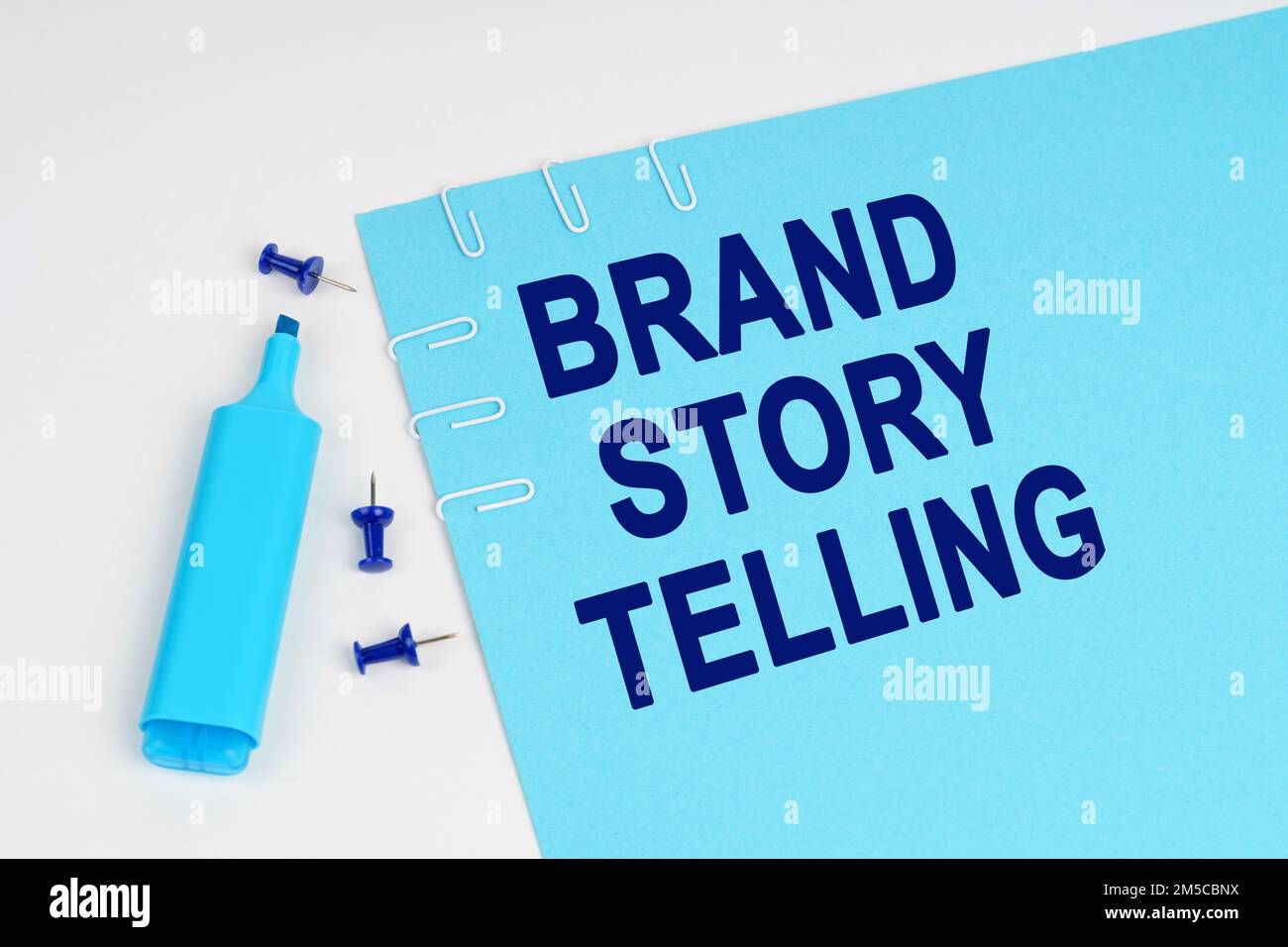 Economic concept. On a white surface, a marker, buttons and a blue ...