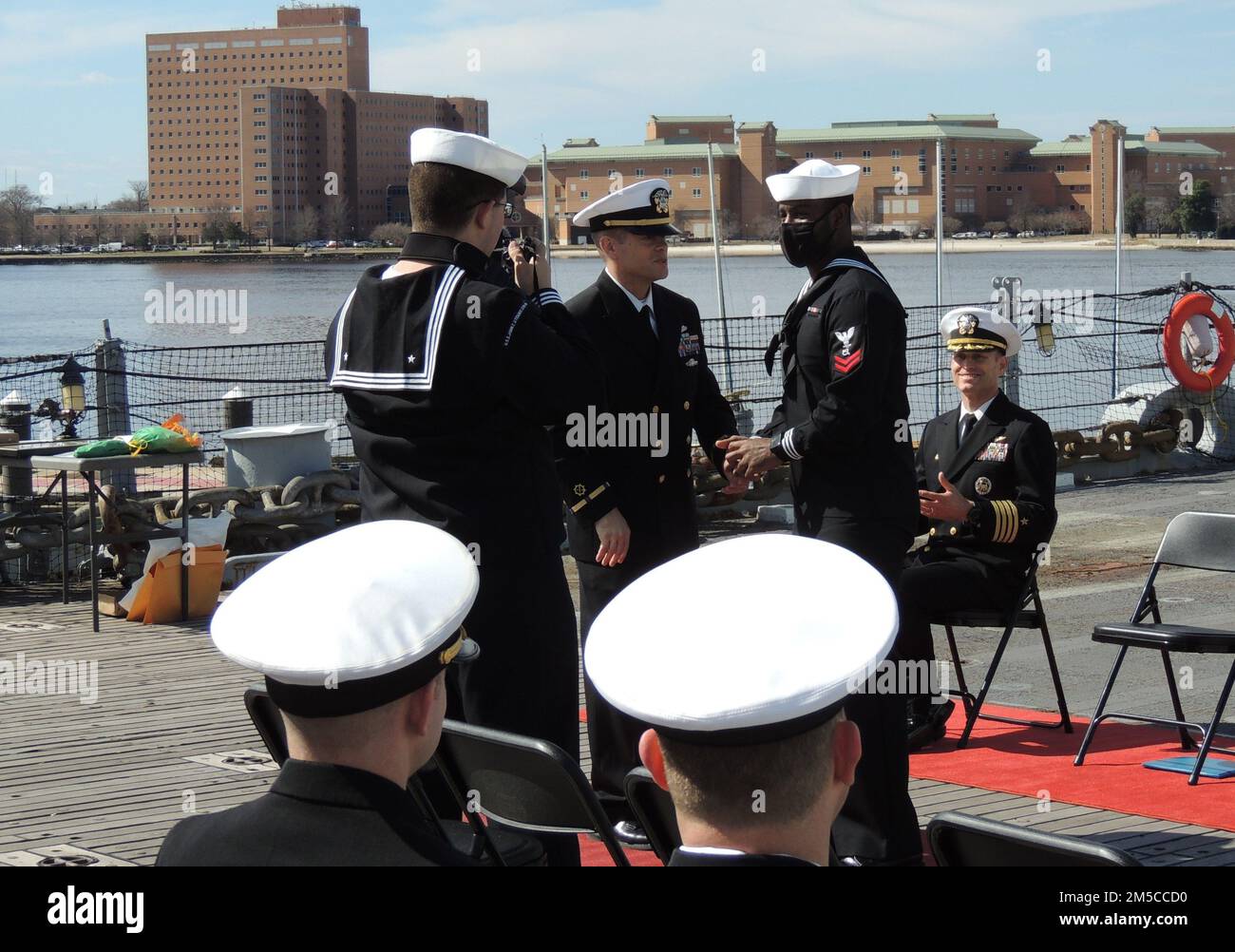 Newly commissioned Chief Warrant Officer 2 Chris Harold renders his ...