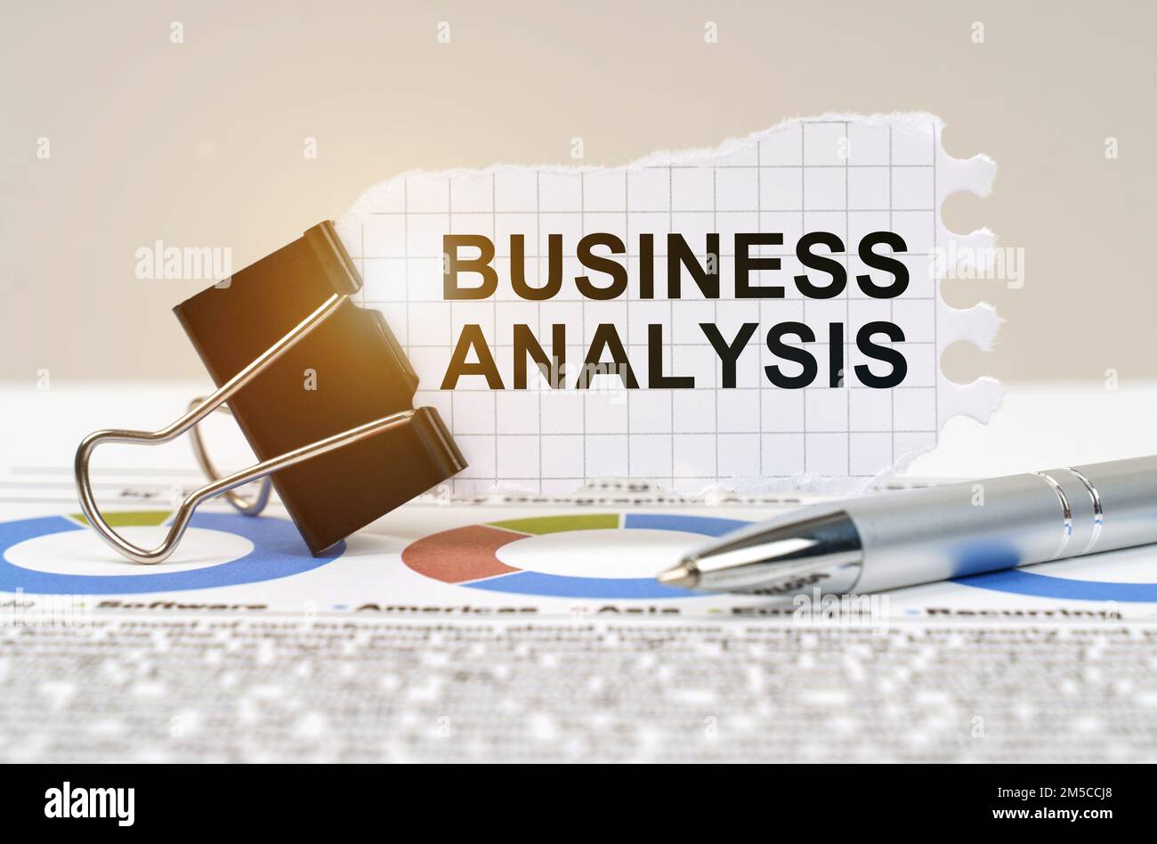 Business concept. On the table are reporting charts, a pen, in a clip ...