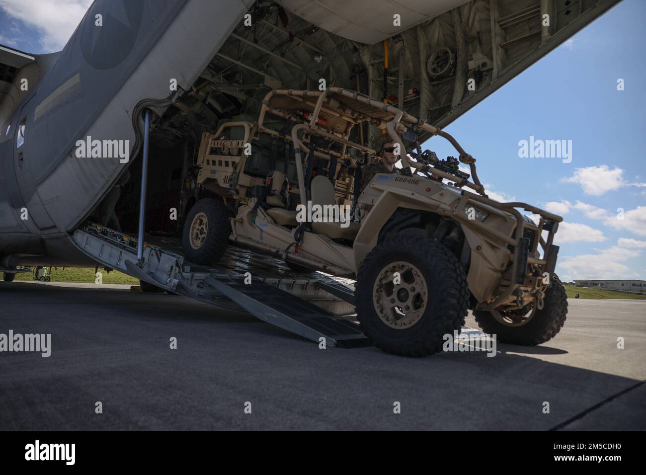 U.S. Marines with 3d Reconnaissance Battalion, 3d Marine Division load ...