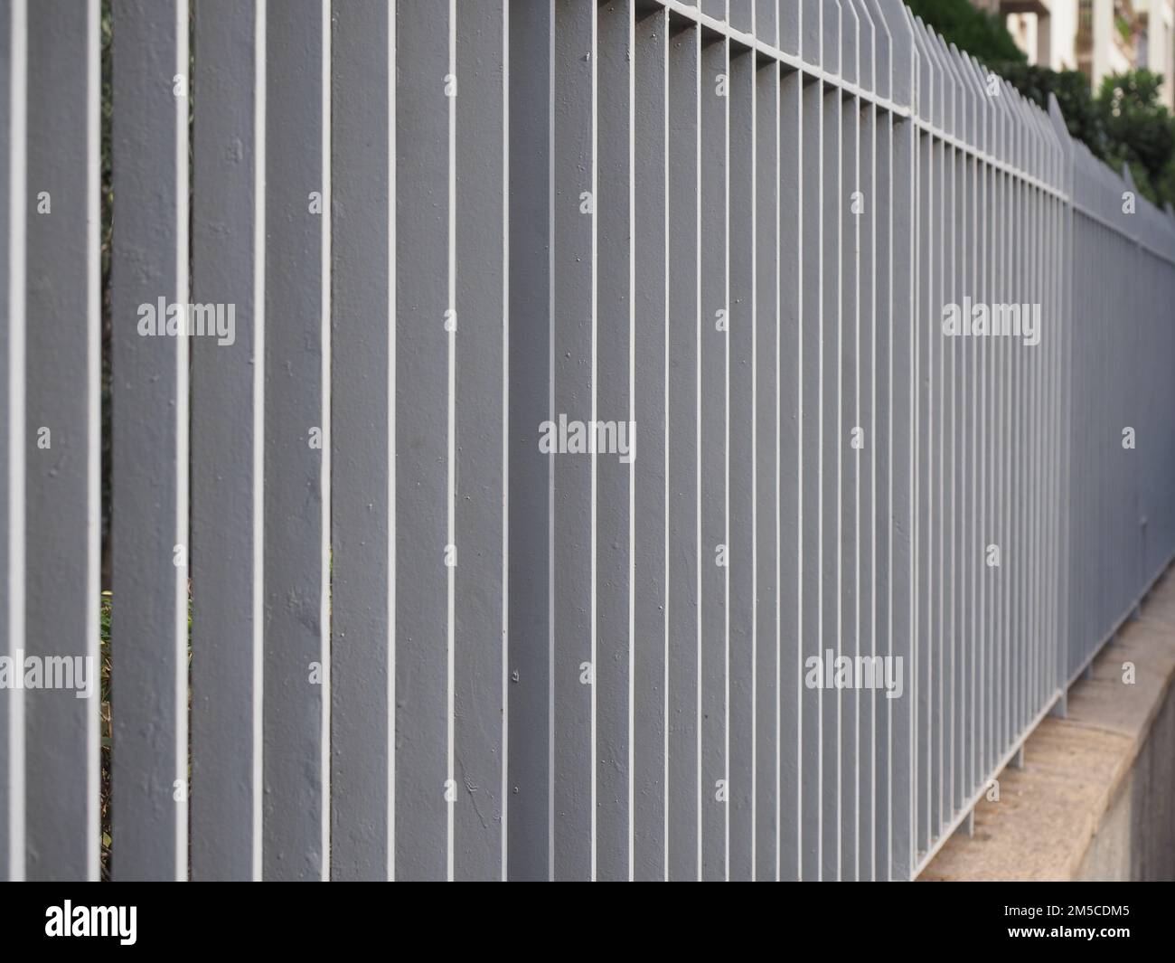 grey metal fence perspective useful as a background Stock Photo - Alamy