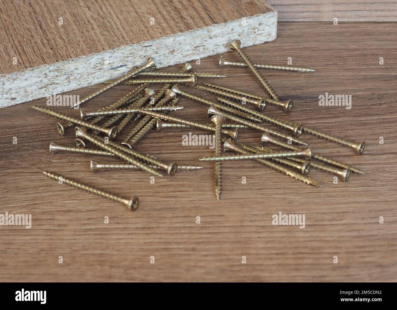 wood screws on melamine manufactured wood panel Stock Photo - Alamy