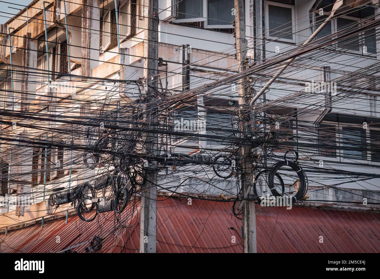 Messy electric cables on poles in Chiang Mai, Thailand Stock Photo - Alamy