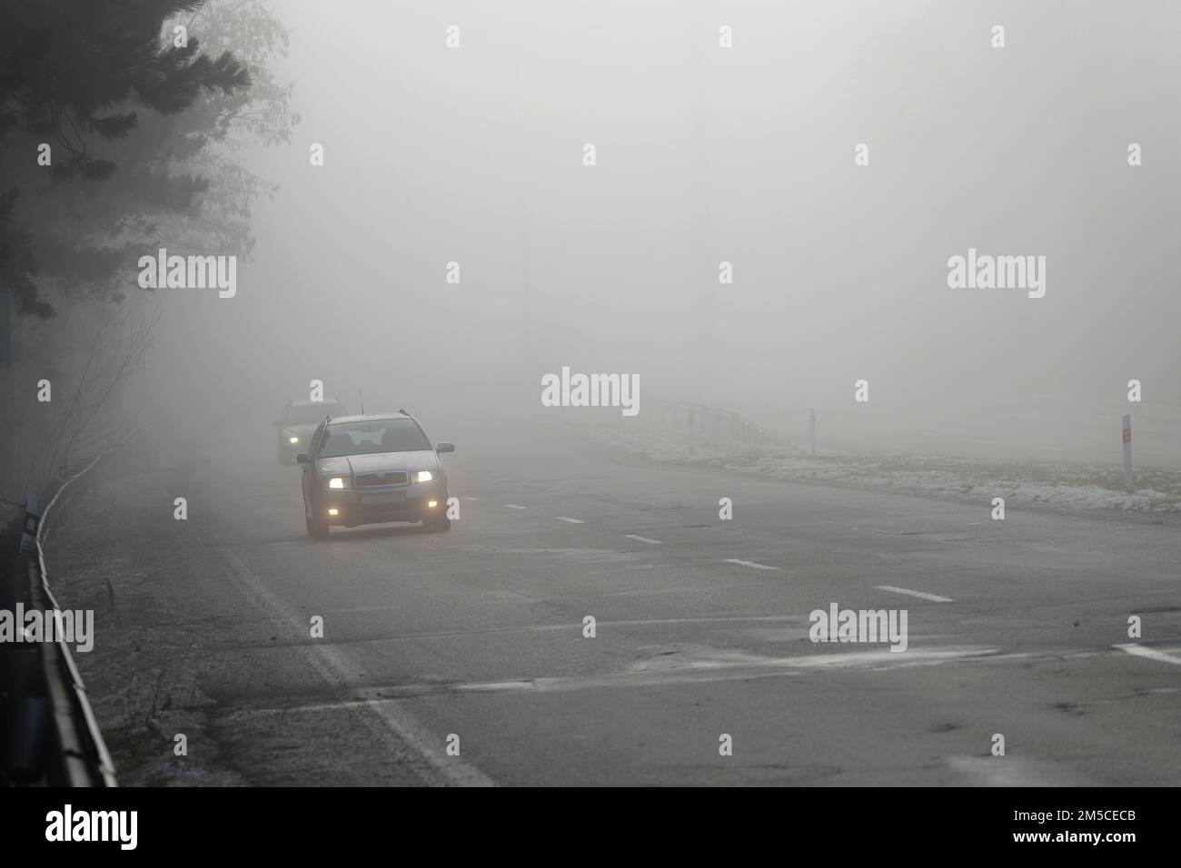 Cars in the fog. Bad winter weather and dangerous automobile traffic on ...