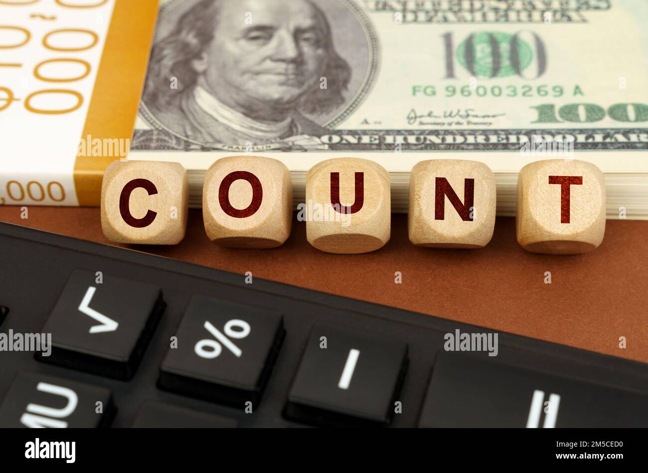 Business concept. Next to the calculator and dollars are cubes with the ...