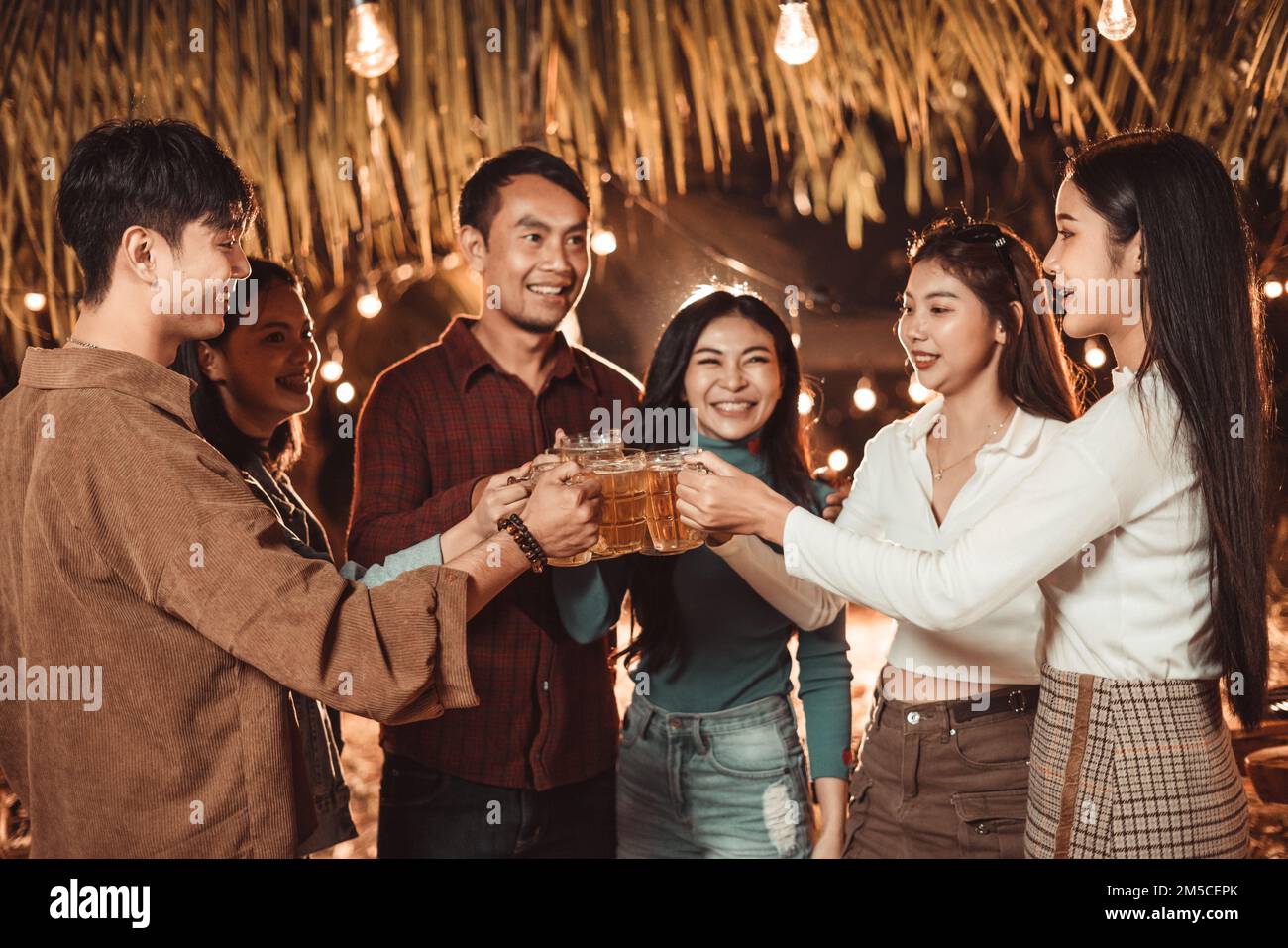 friendship of party enjoying cheer beer drink Stock Photo - Alamy