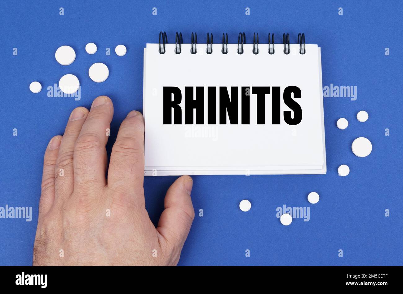 Medical concept. On the blue surface of the tablet, a hand and a ...